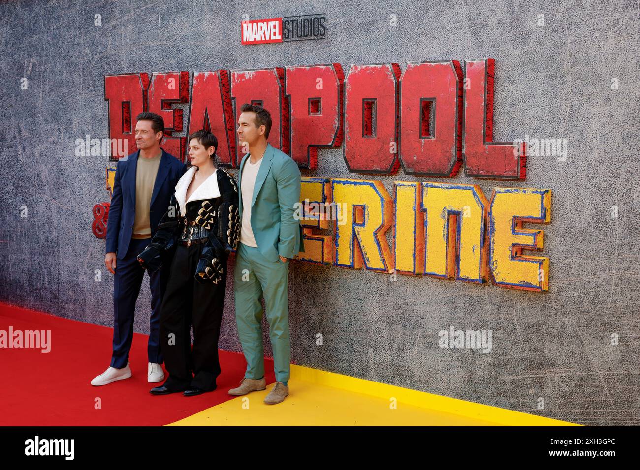 Ryan Reynolds, from left, Hugh Jackman, and Emma Corrin pose for ...