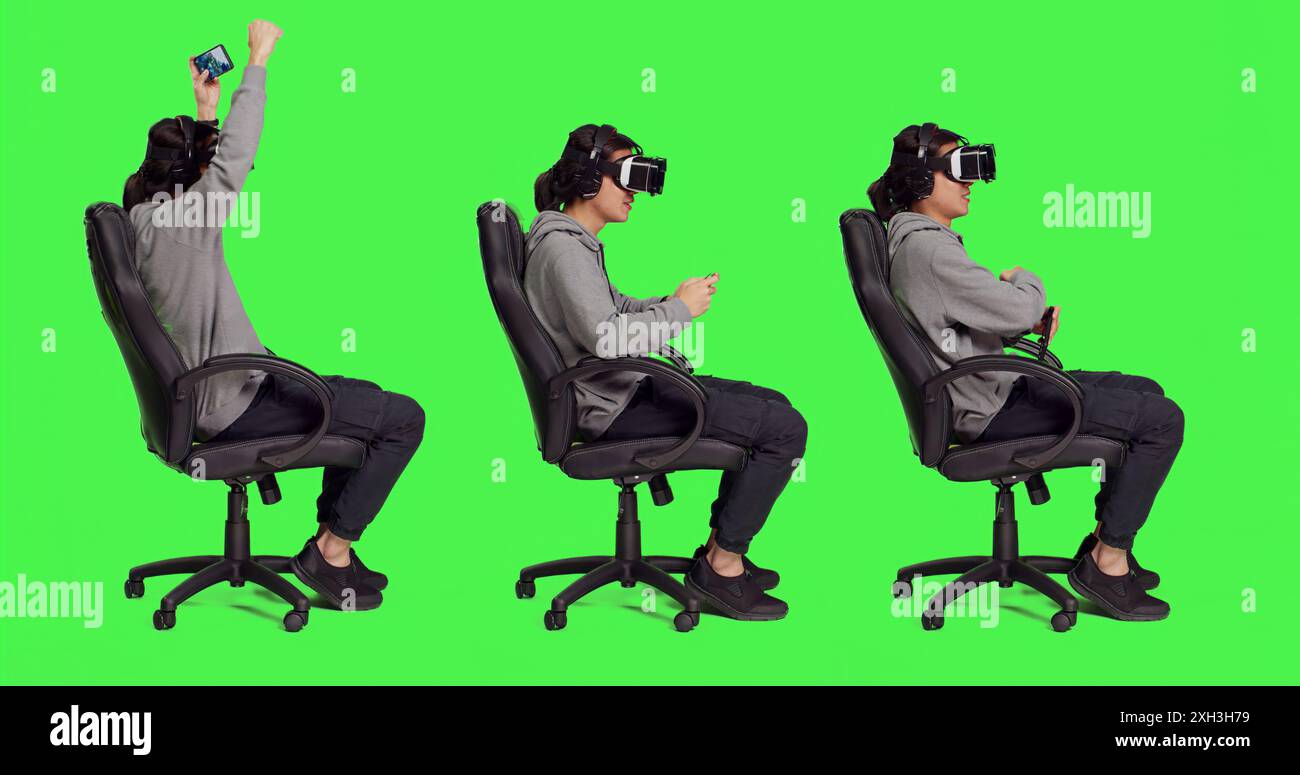 In studio, asian adult enjoys phone game with vr headgear, participating in online roleplaying ...