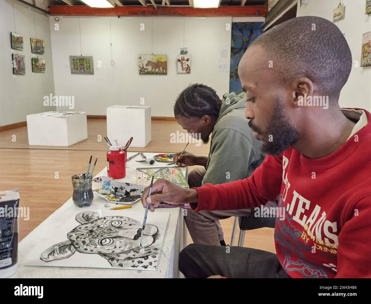 Windhoek, Namibia. 11th July, 2024. Artists draw paintings during an ...