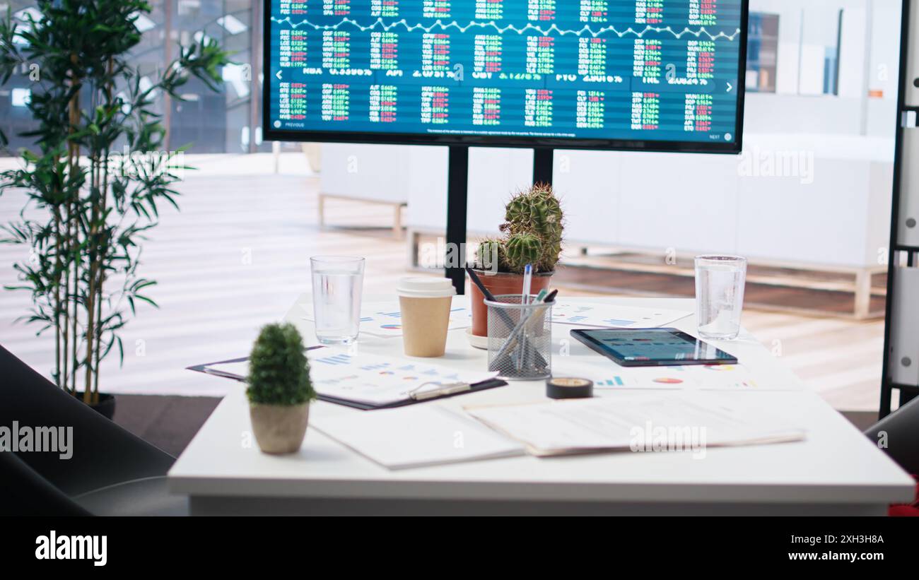 Stock exchange indices on screen in empty financial department office ...