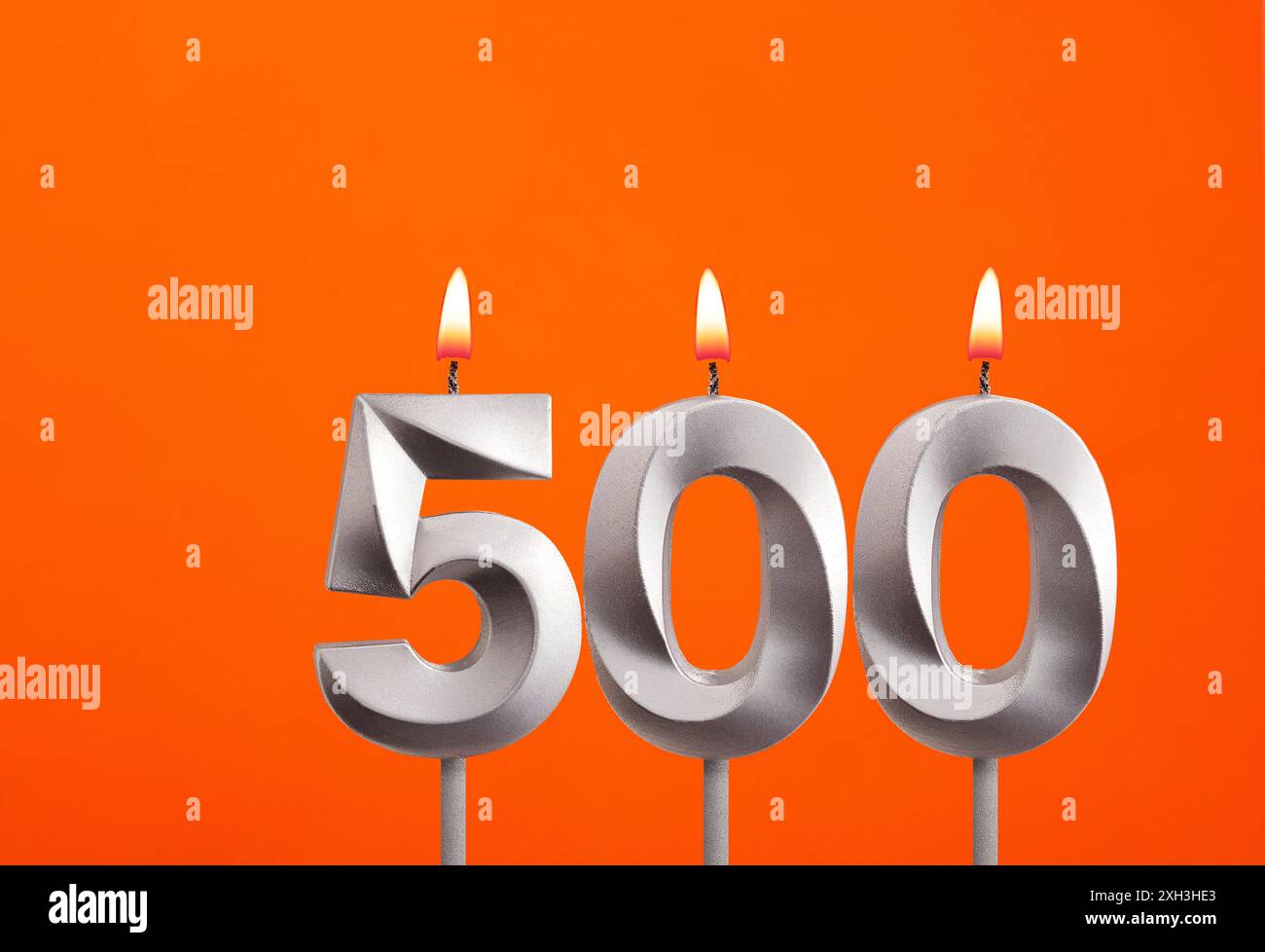 Candle number 500 - Birthday in orange background Stock Photo - Alamy