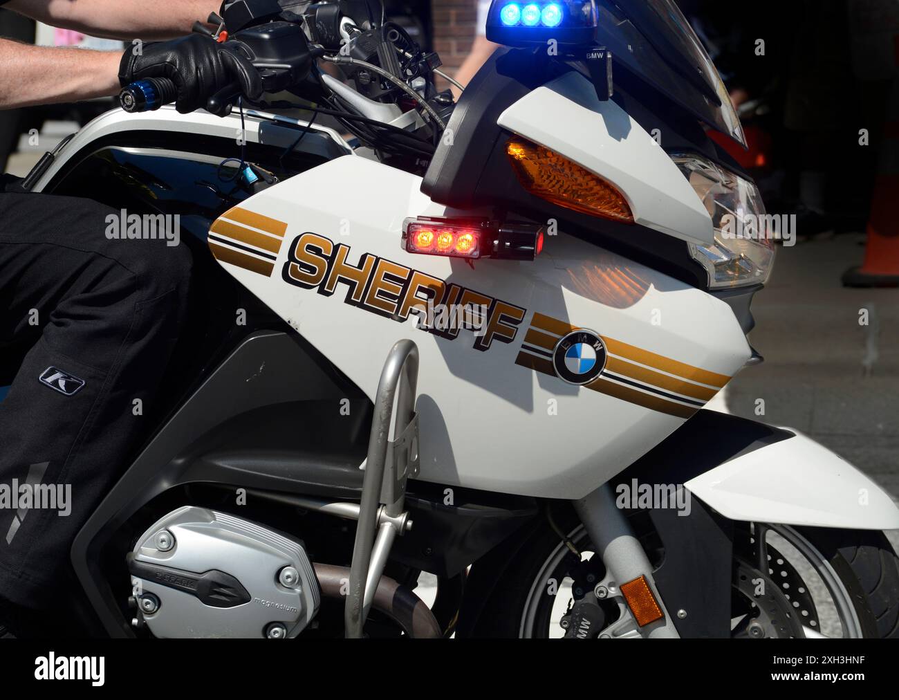 A Henderson County Sheriff's Department officer on a motorcycle patrols ...