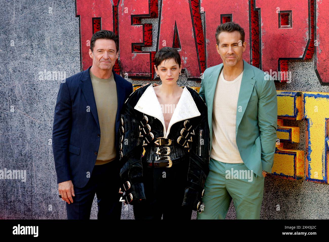 Ryan Reynolds, from left, Hugh Jackman, and Emma Corrin pose for ...