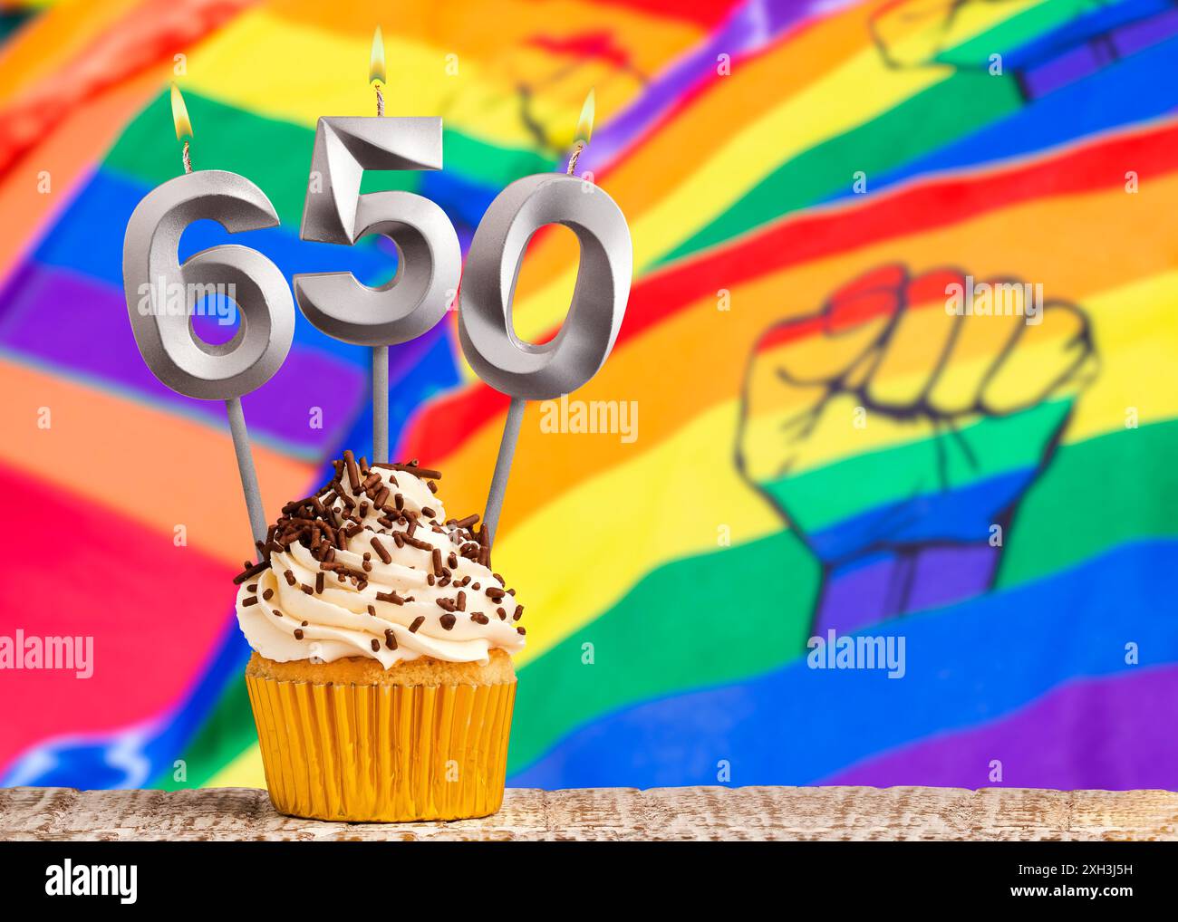 Birthday candle number 650 - Gay march flag background Stock Photo - Alamy