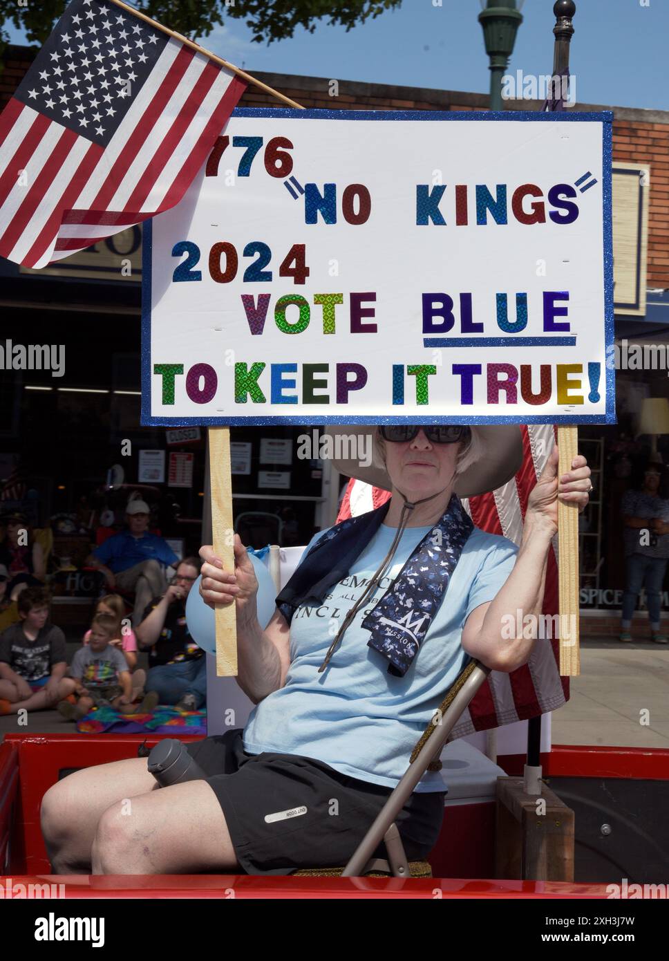 A member of the U.S. Democratic Party holds an anti-Donald Trump sign ...