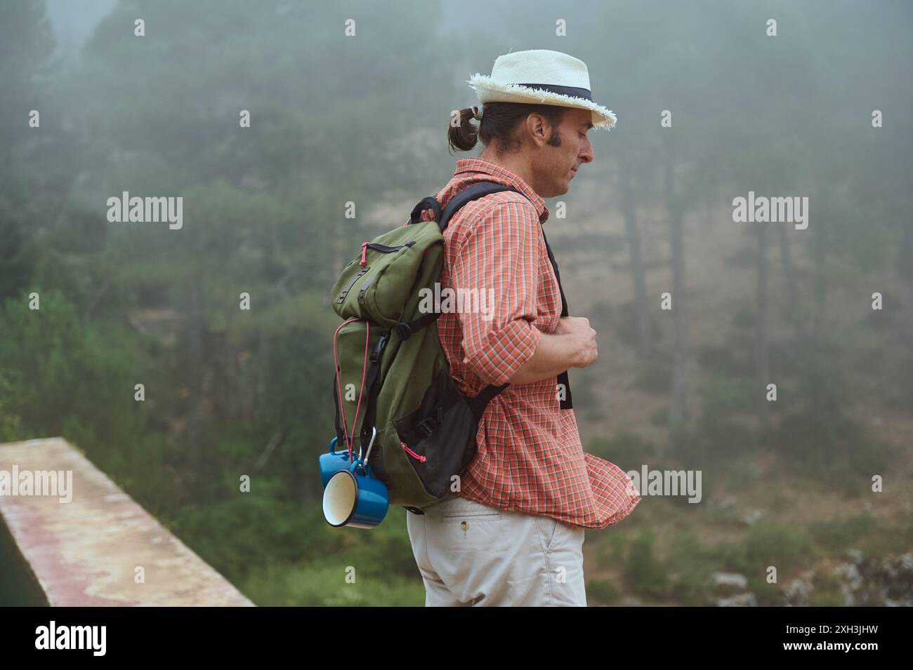 Male visitor backpack stands hi-res stock photography and images - Alamy