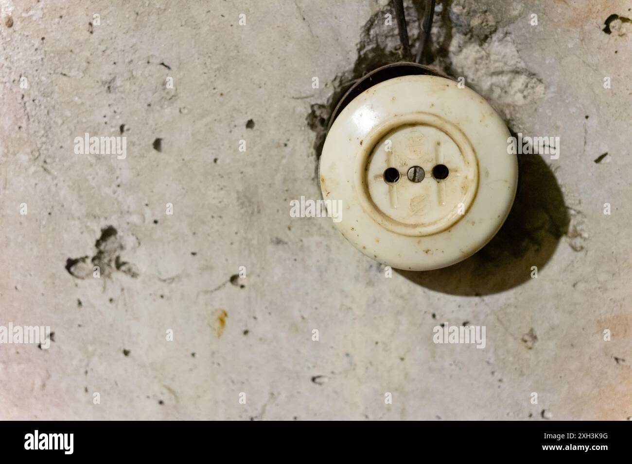 Ancient socket on a concrete wall Stock Photo - Alamy