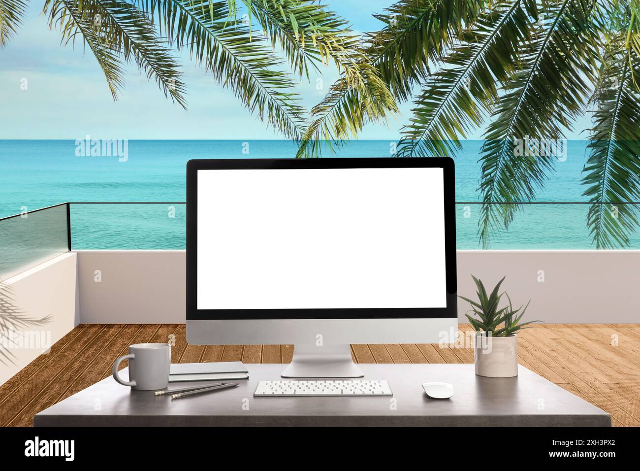 Workplace at beach, distant office. Table with computer on seashore ...