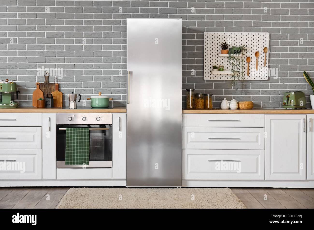 Interior of modern kitchen with counters and stylish fridge Stock Photo ...