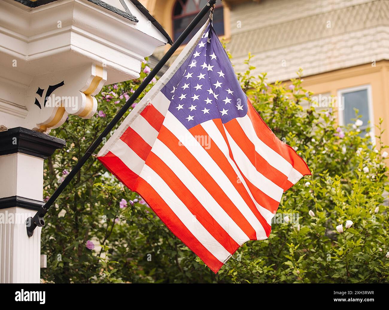 American flag front of house hi-res stock photography and images - Alamy