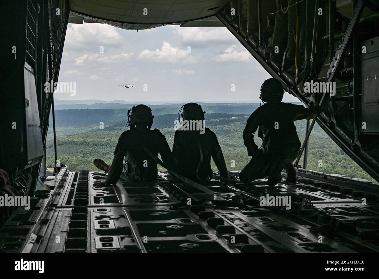 Two U.S. Air Force Academy cadets sit with a 41st Airlift Squadron ...