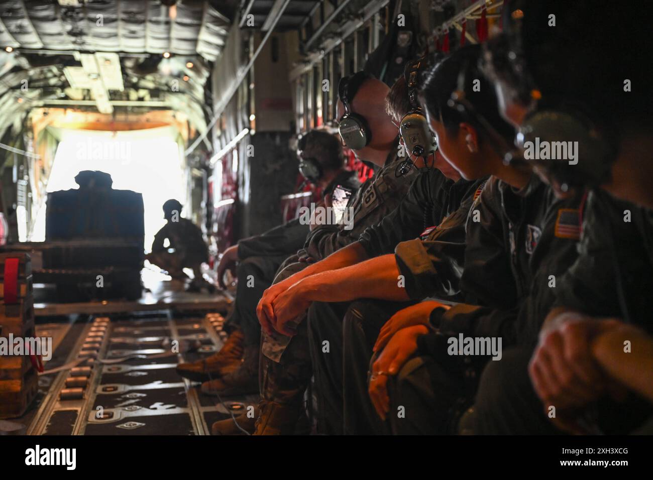 U.S. Air Force Academy cadets watch as a C-130J Super Hercules ...