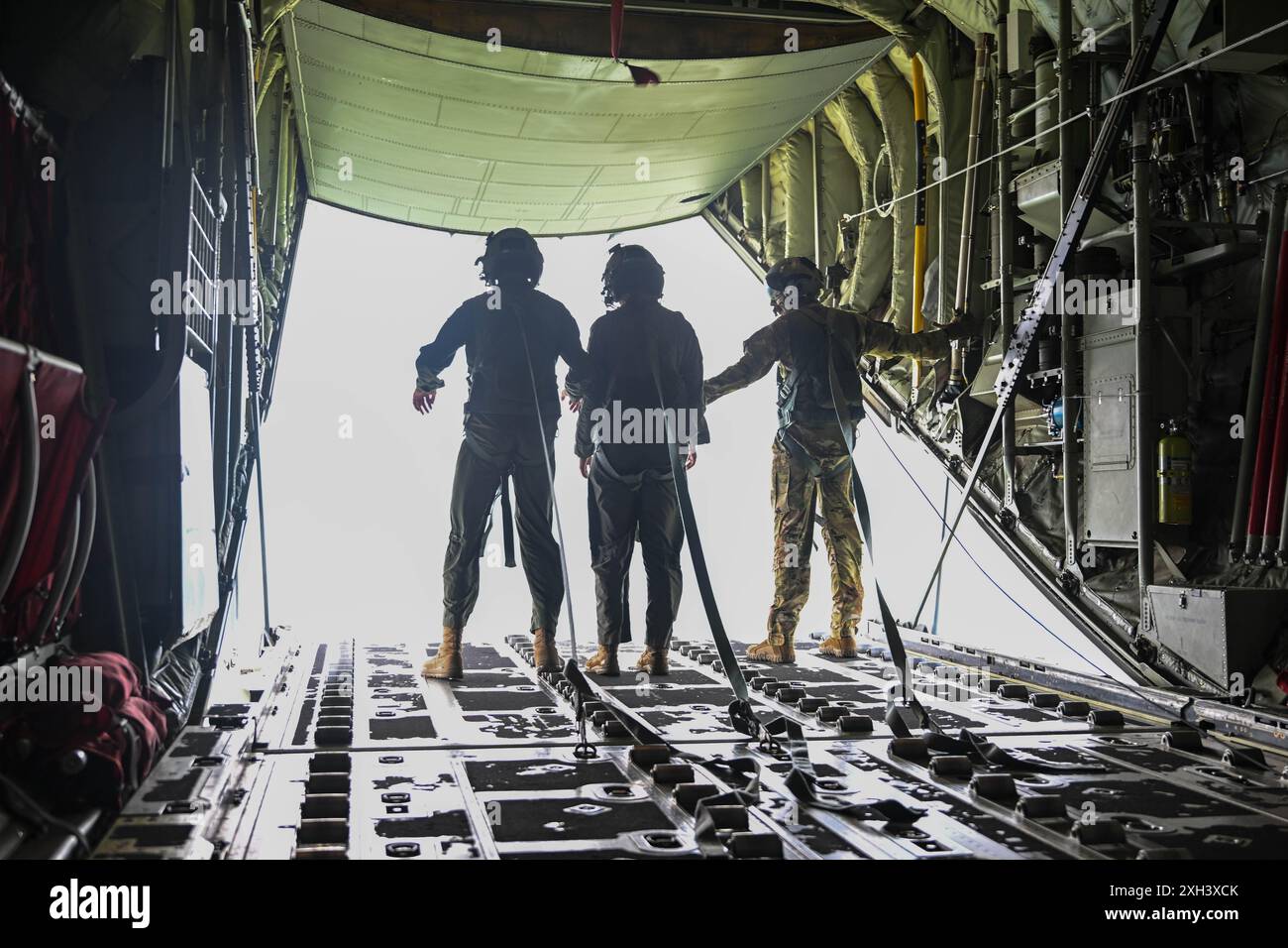 Two U.S. Air Force Academy cadets stand on the ramp of a C-130J Super ...