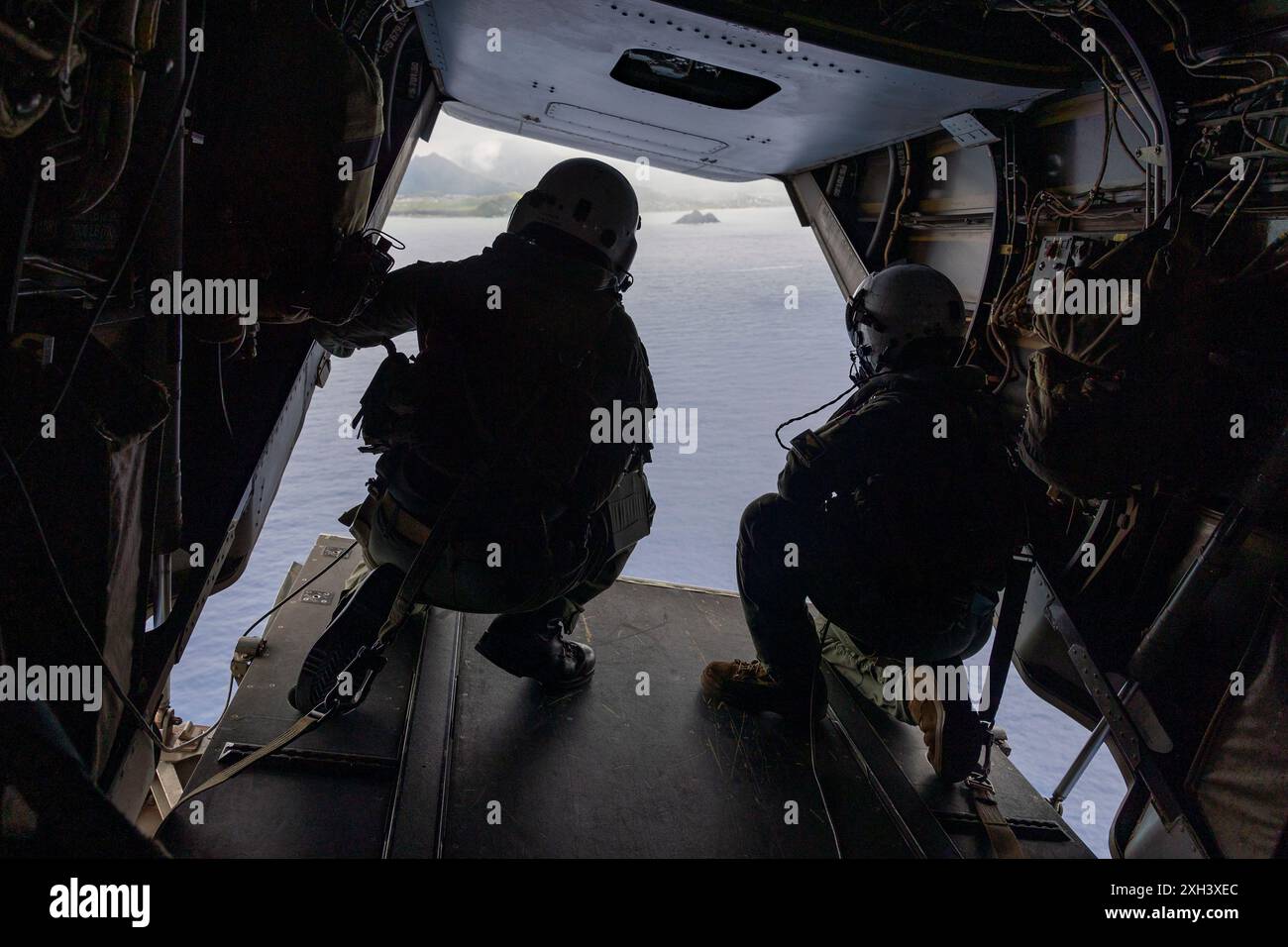 U.S. Marine Corps Staff Sgt. James C. Nelson, left, a weapons training ...