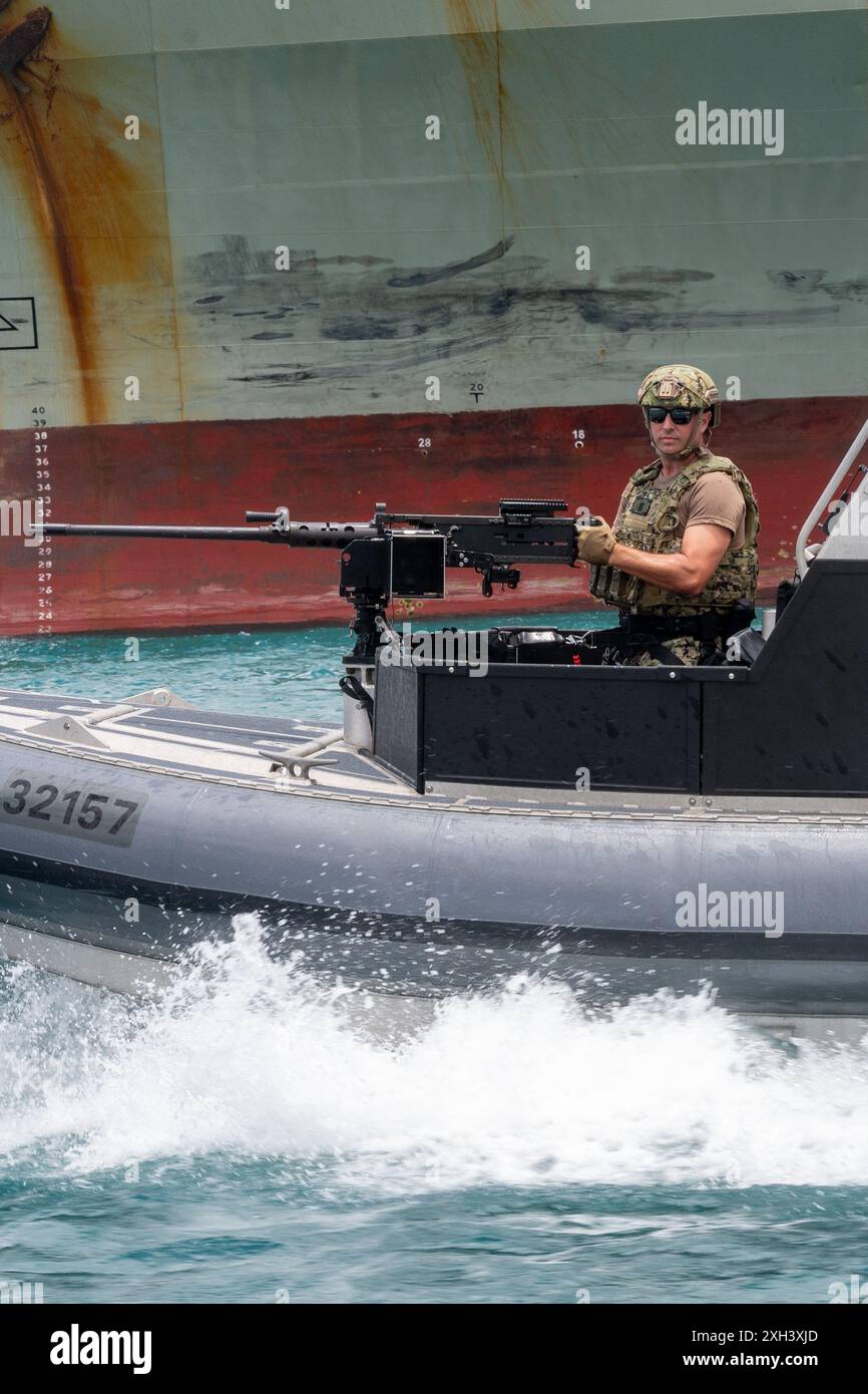 U.S. Coast Guardsman Boatswains mate 1st class Timothy Fine assigned to ...