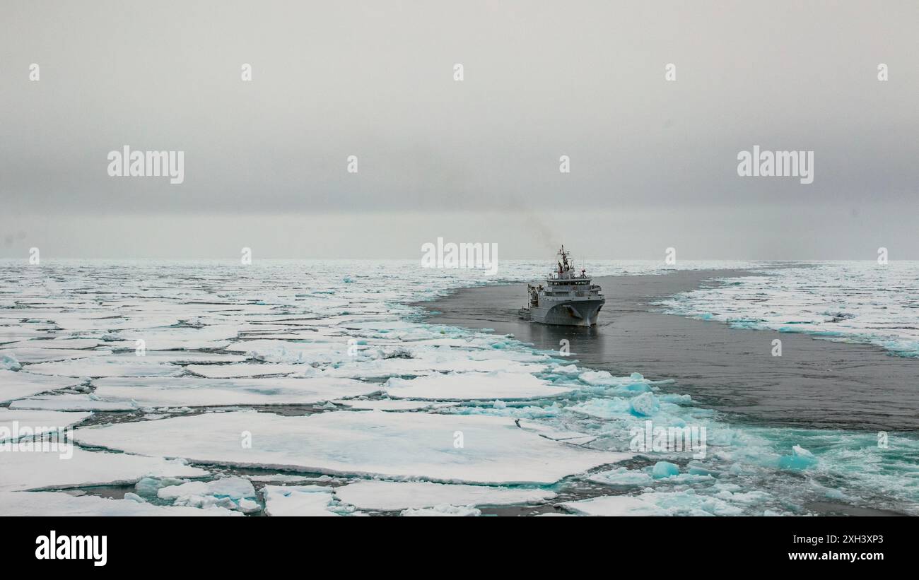 French Navy Ship Rhone transits through a channel created by French ...