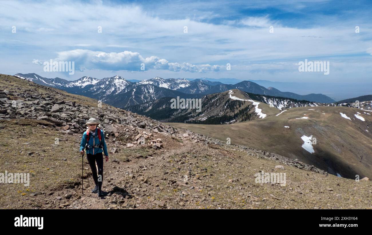 Adult single woman hiking with her black lab on Gold Hill mountain in ...