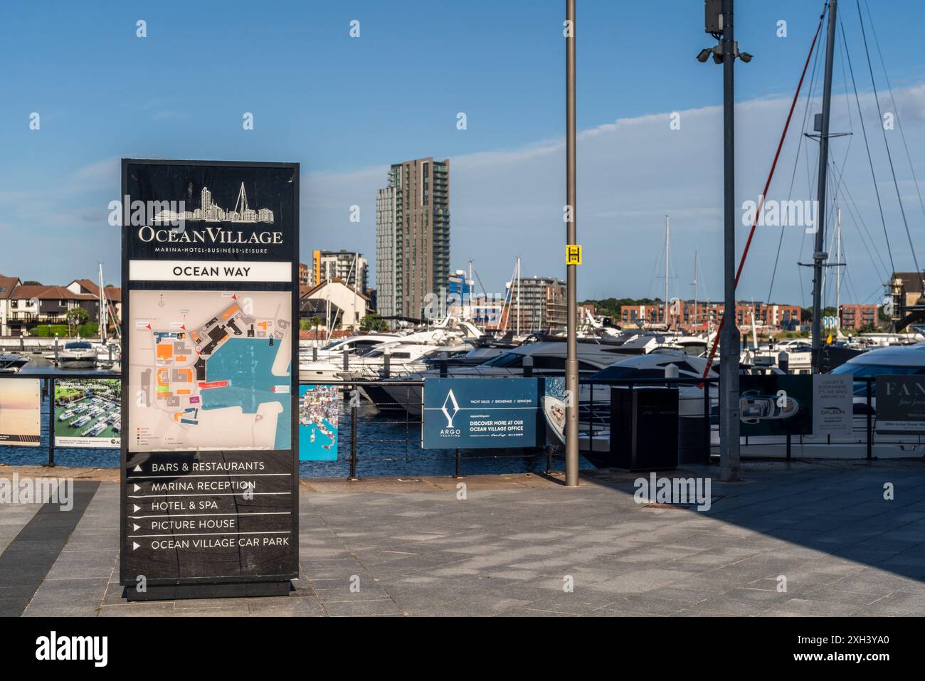 Sign at the entrance to Ocean Village marina along Ocean Way on a sunny ...