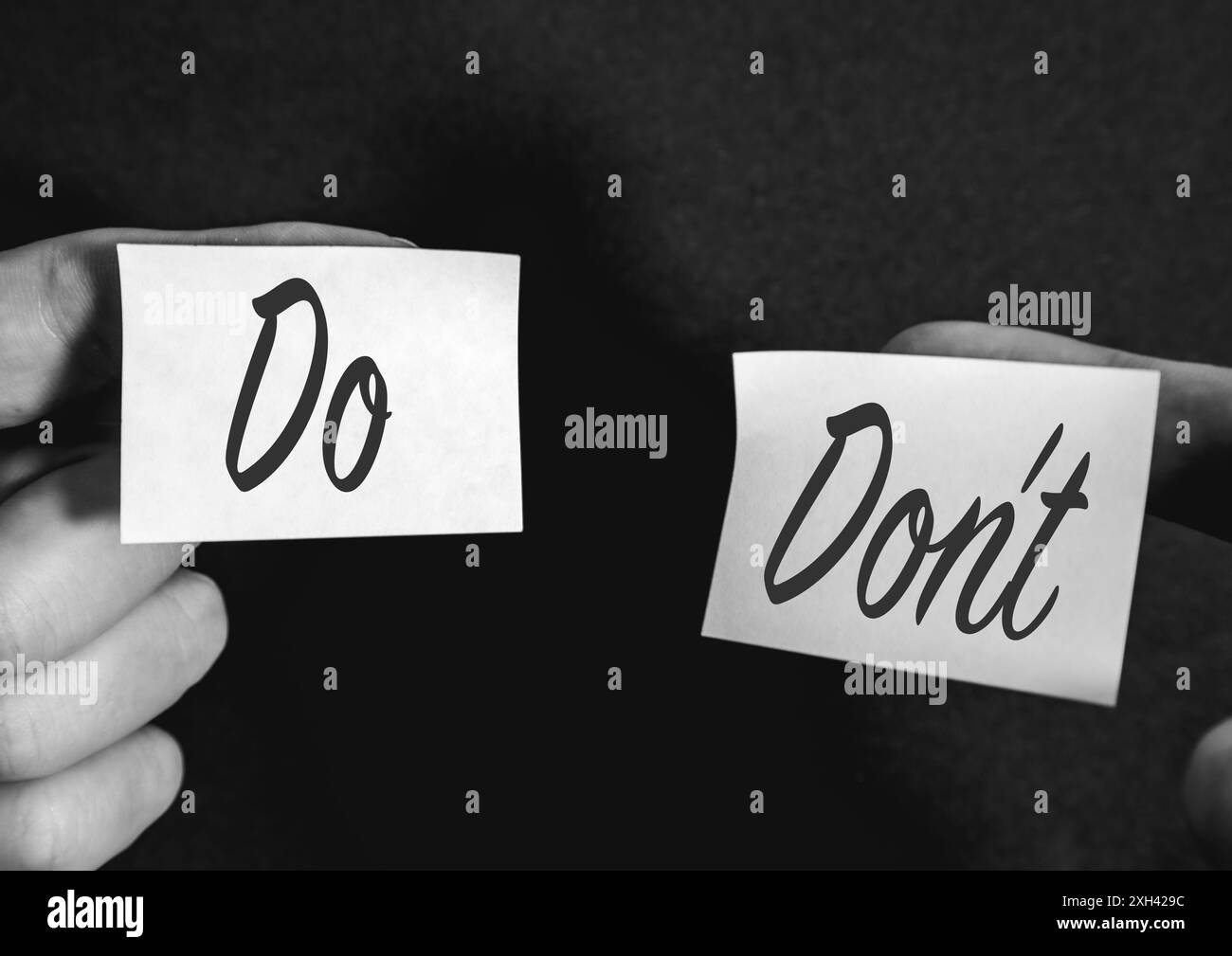 Two sticky notes on a black background, with Do's and Dont's Stock ...