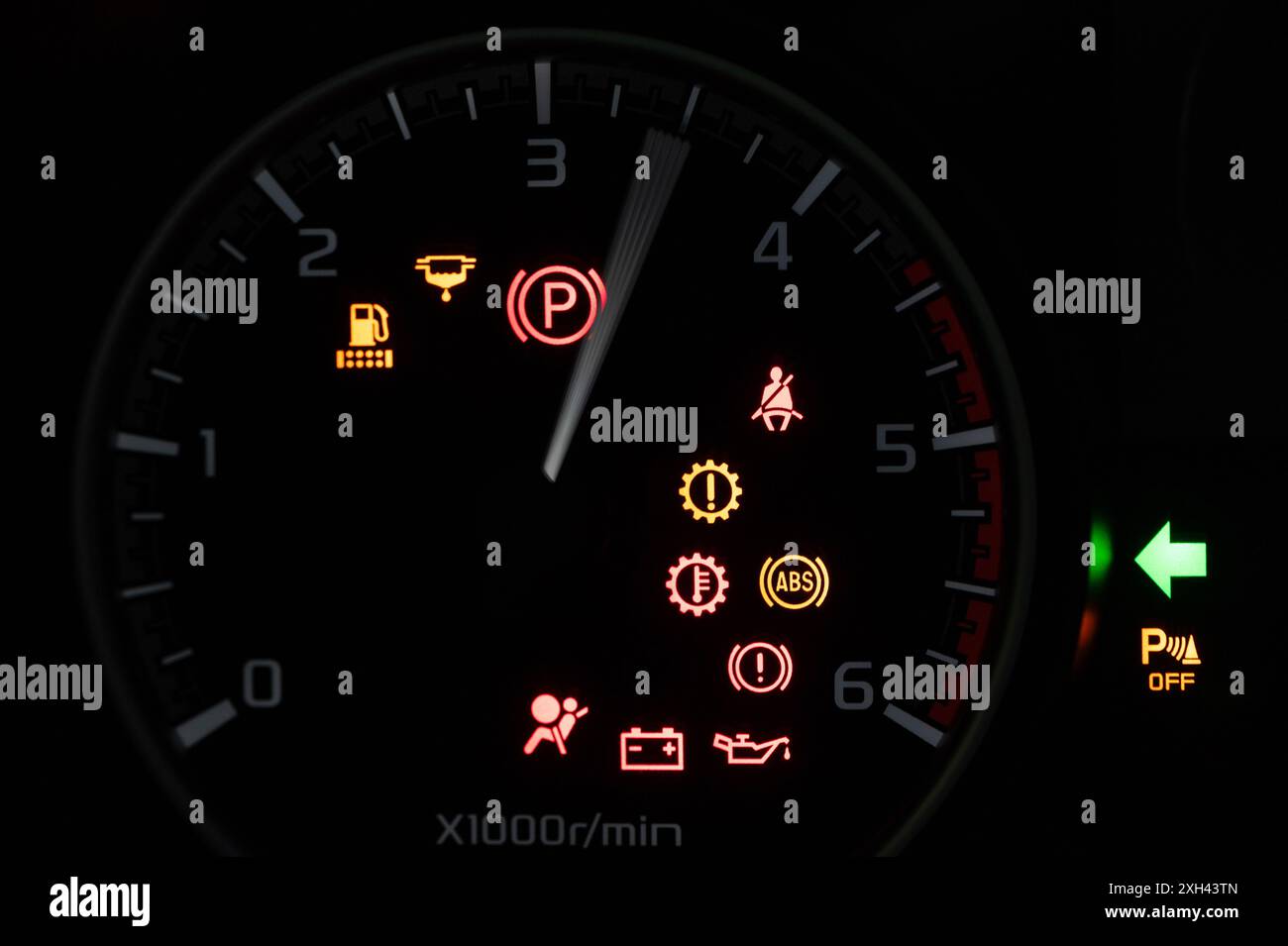 Tachometer gauge with illuminated warning error signs close up view ...