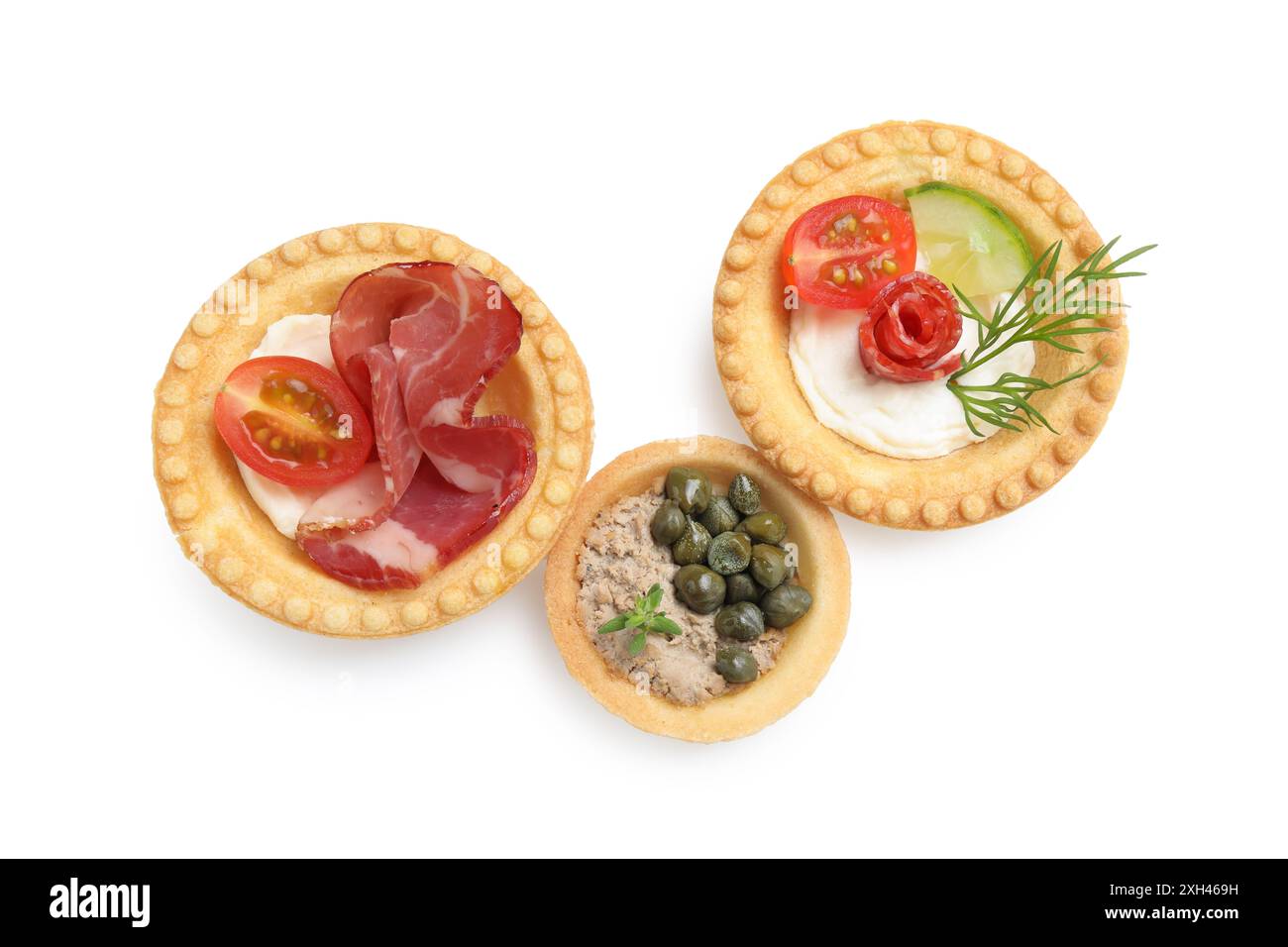 Delicious canapes with dry smoked sausage, jamon and pate isolated on ...