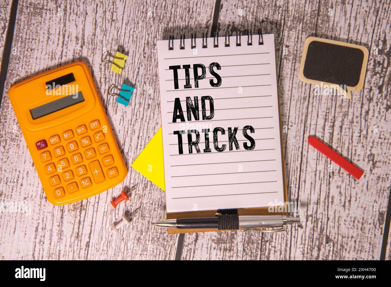 TIPS AND TRICKS text on a notebook with chart on gray background Stock ...