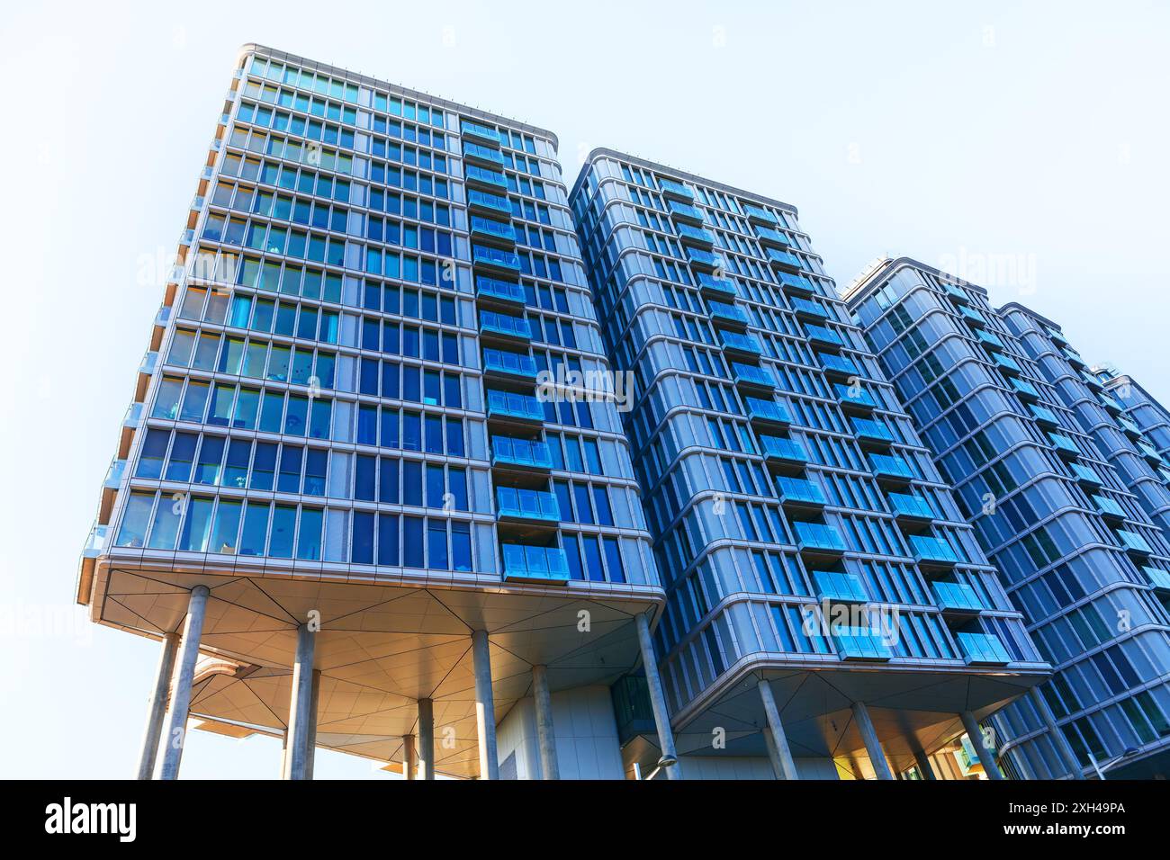 Modern buildings with numerous windows reaching into the sky ...