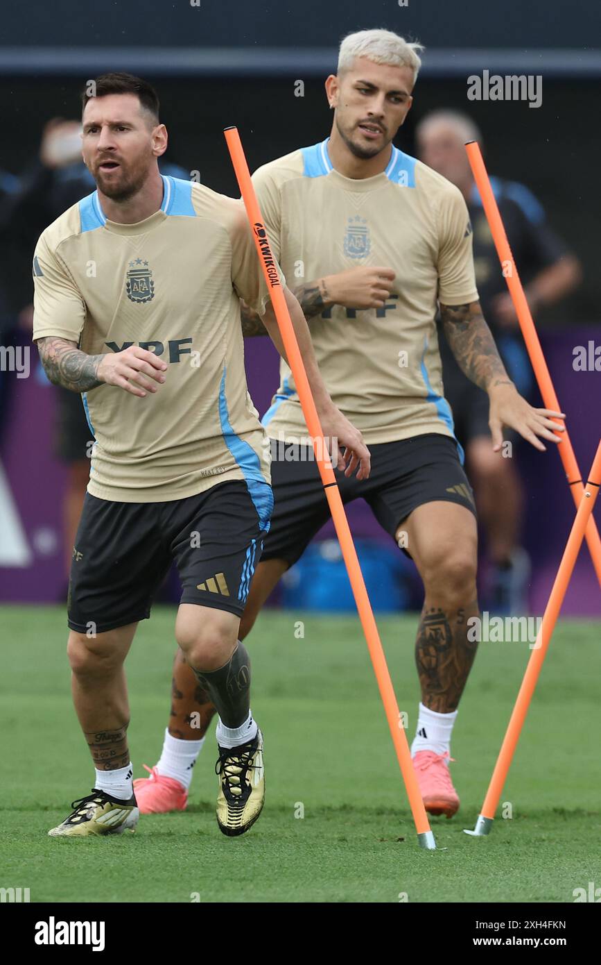 Argentina's forward Lionel Messi (L) and midfielder Leandro Paredes ...