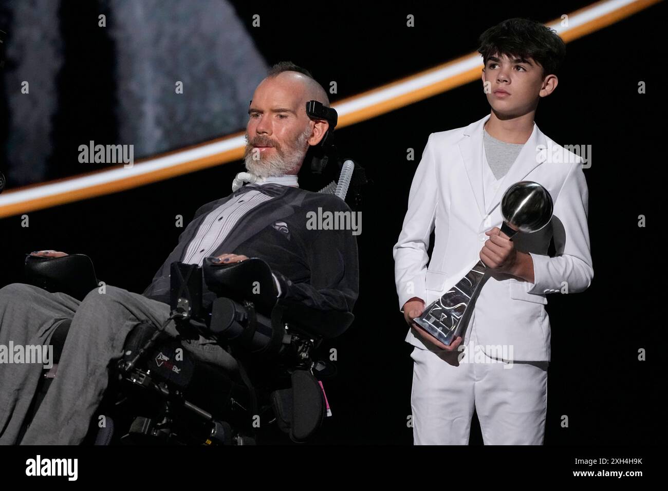 Steve Gleason, left, recieves the Arthur Ashe Award for Courage, held ...