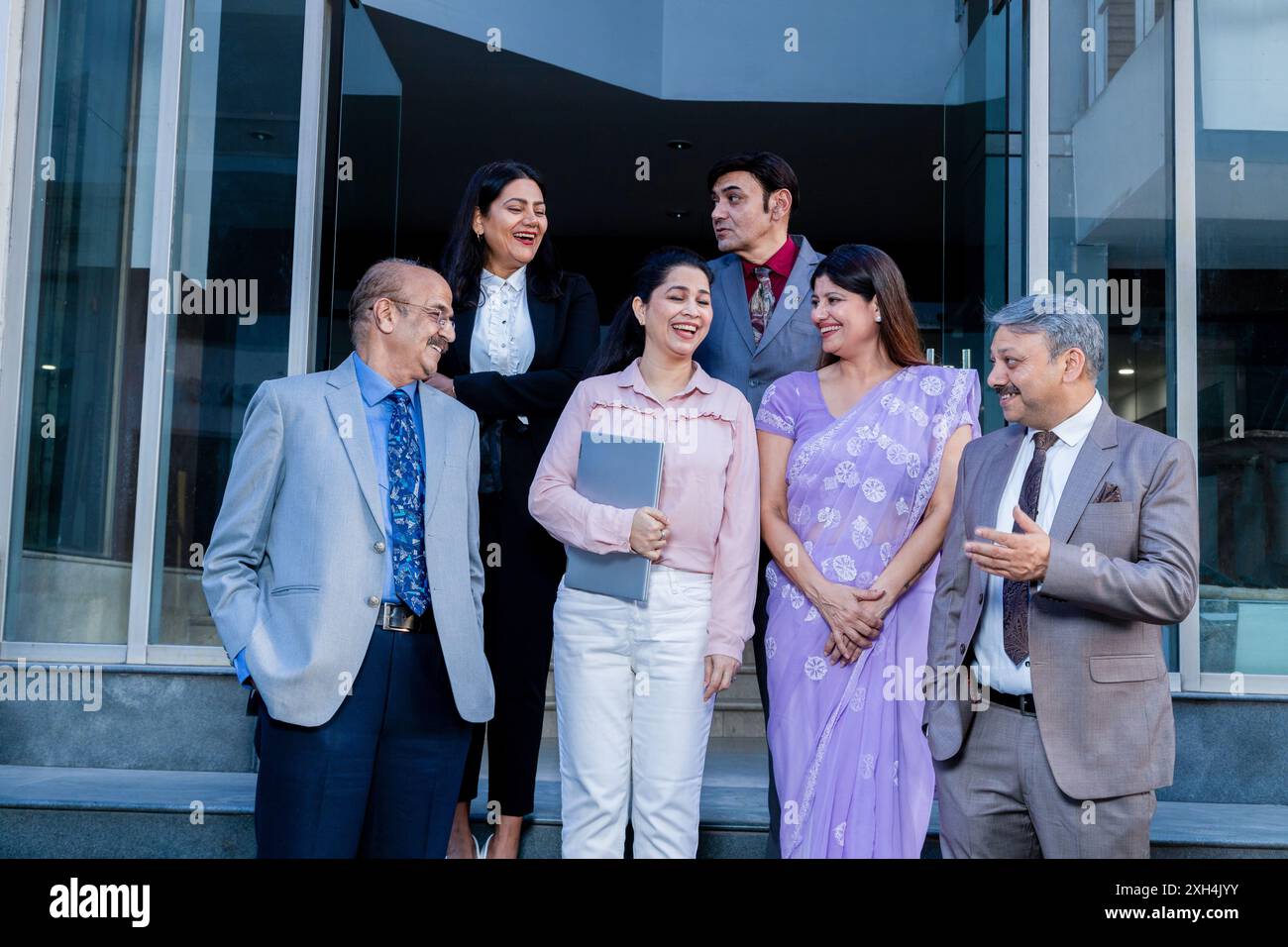 Group of indian corporate businesspeople standing outside office ...