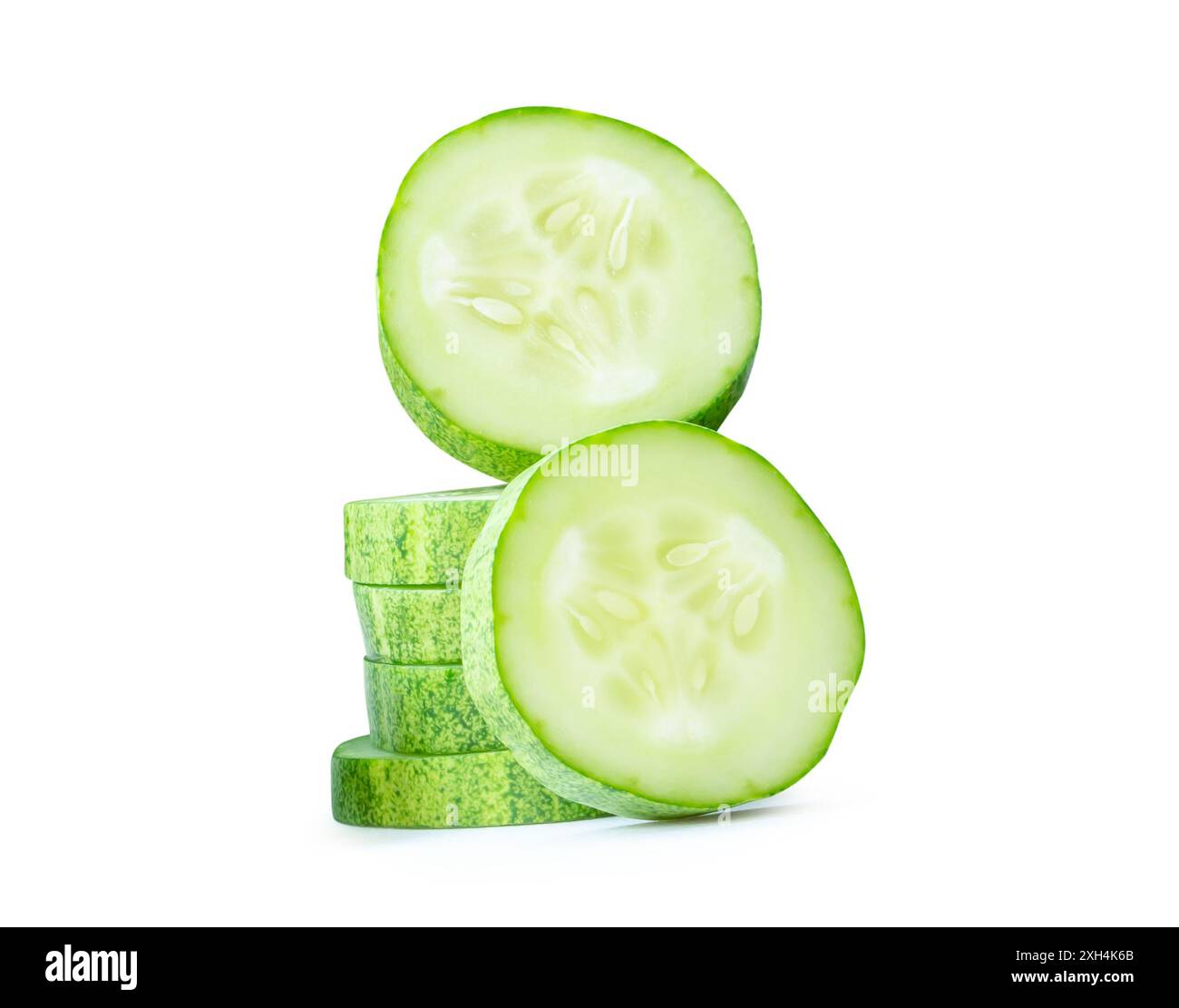 Front view of green cucumber slices or pieces in stack is isolated on ...