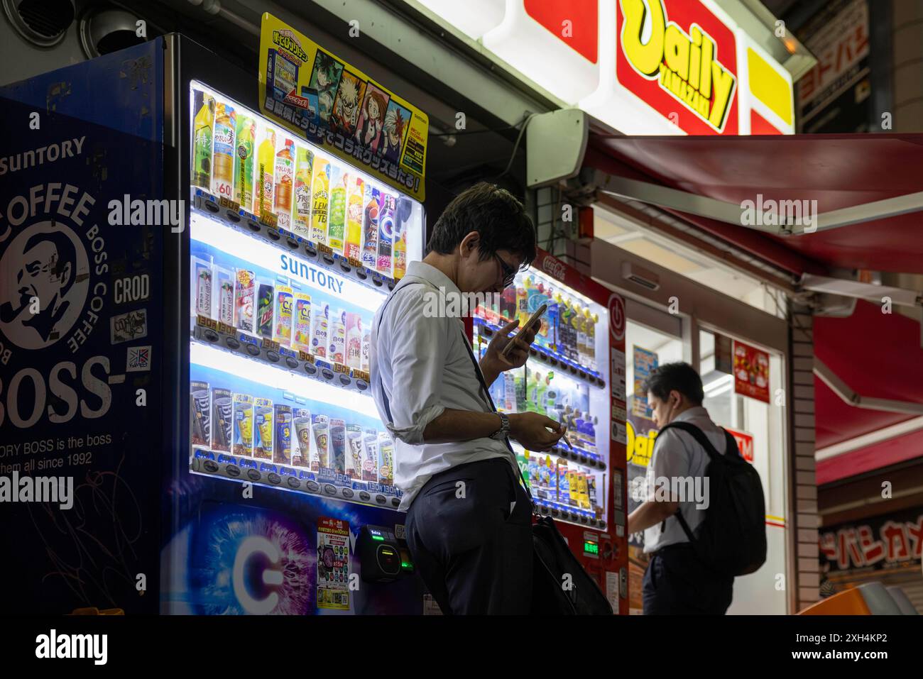 Tokyo, Japan. 11th July, 2024. Japanese salesman smokes a cigarette ...
