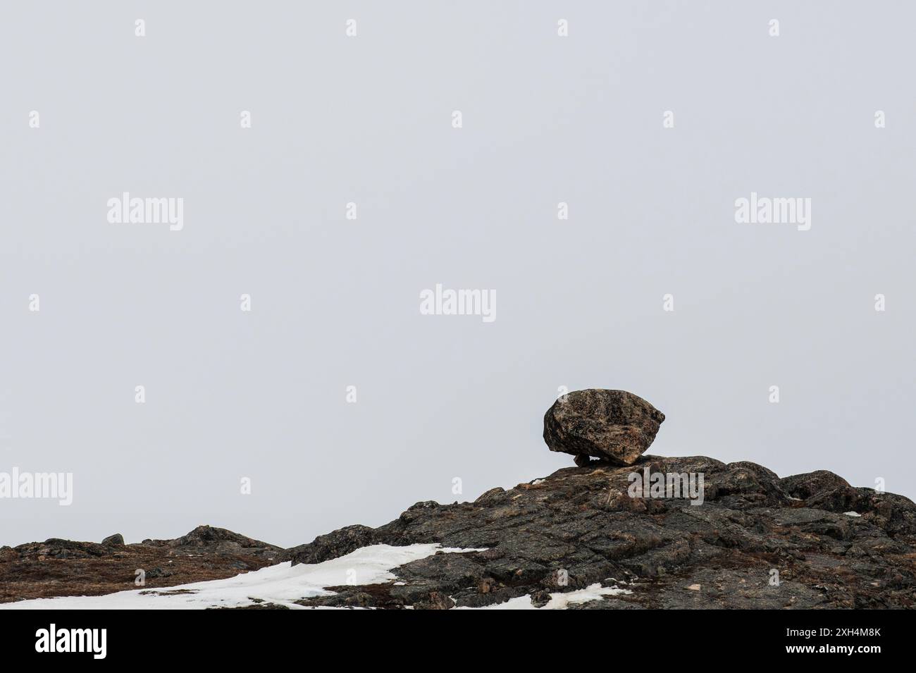 Tiny rock supporting a large boulder on Niaqunngusiariaq in Apex ...