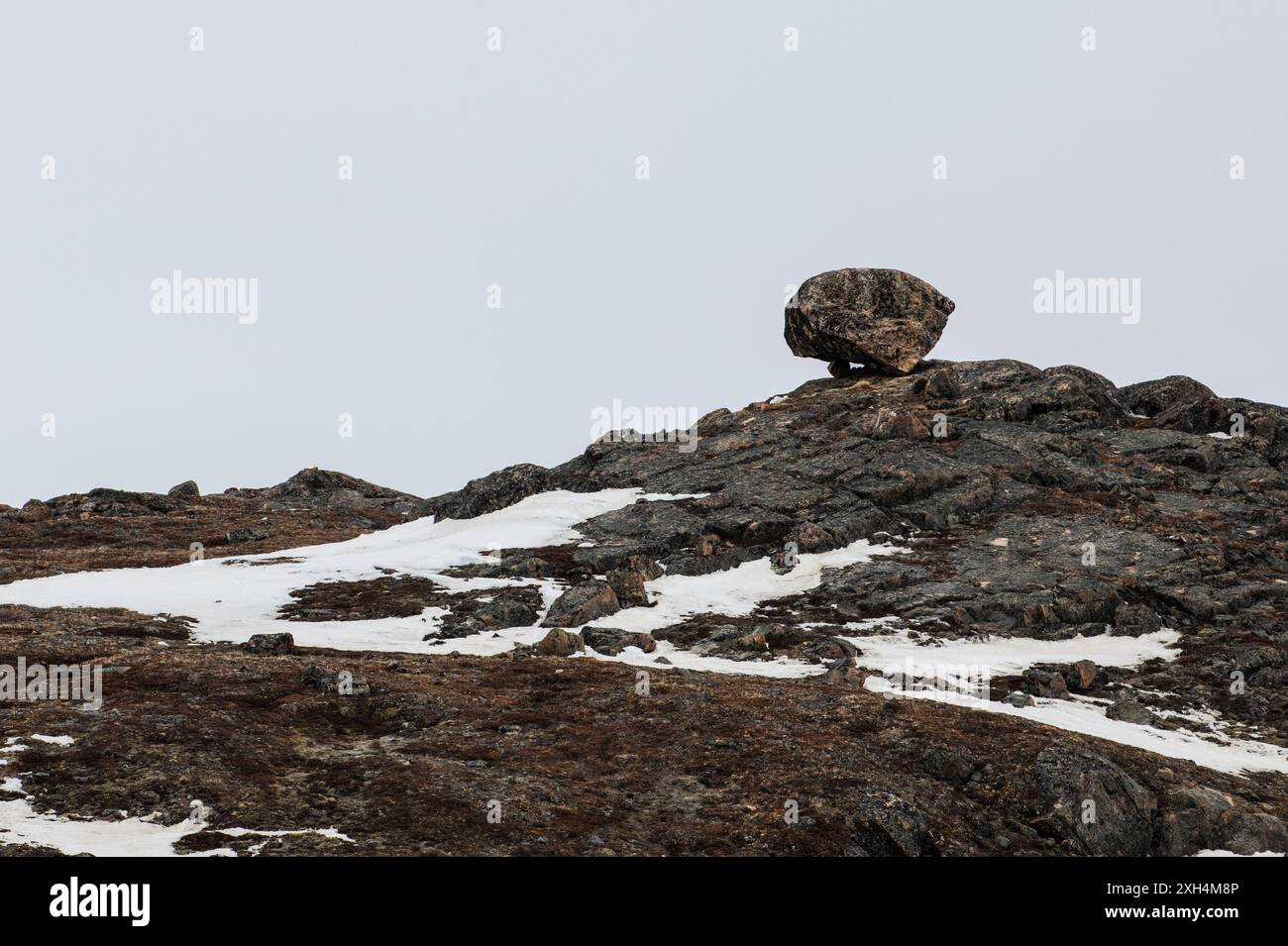 Tiny rock supporting a large boulder on Niaqunngusiariaq in Apex ...