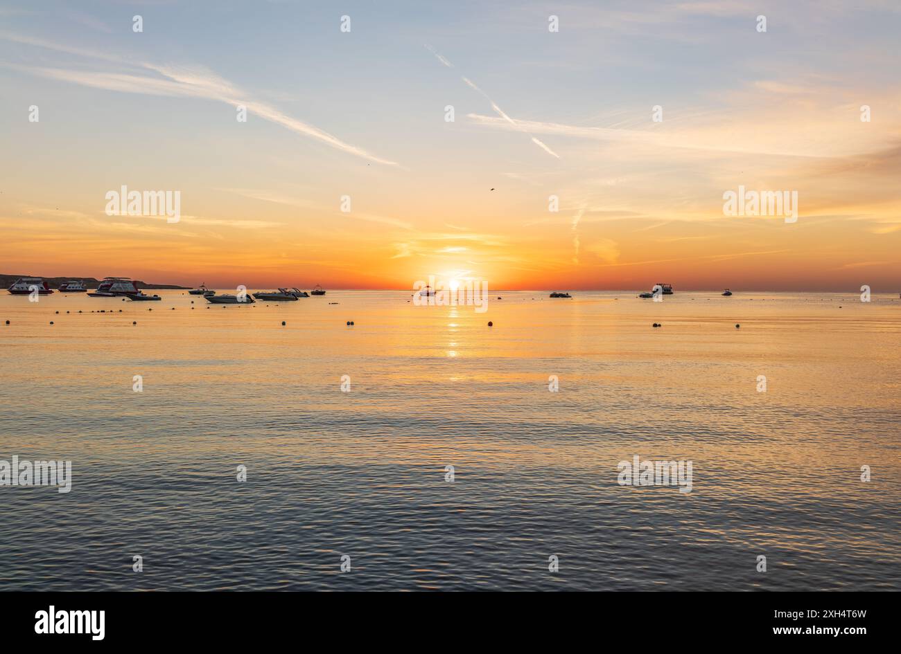 Sunrise over the sea. Panoramic seascape. Burning sky and shining ...