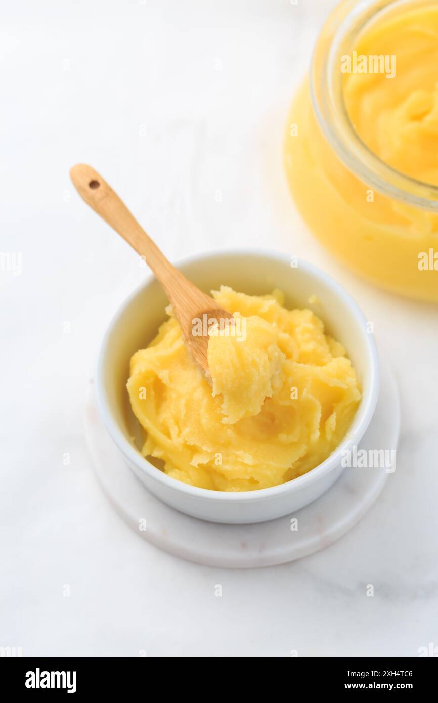 Ghee or clarified butter in jar and bowl. Indian butter Stock Photo - Alamy