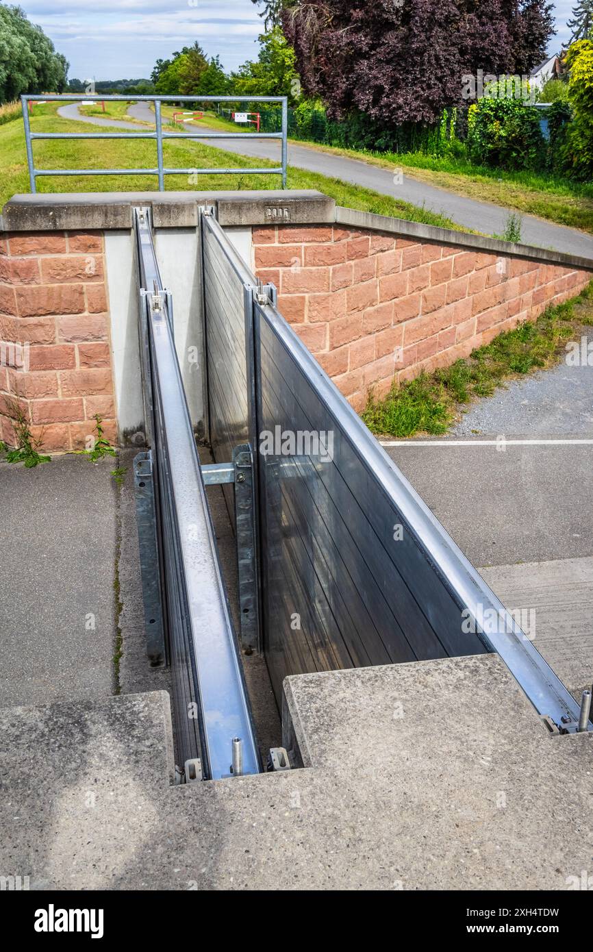 Modern flood barrier on a road, flood gates protecting city against ...