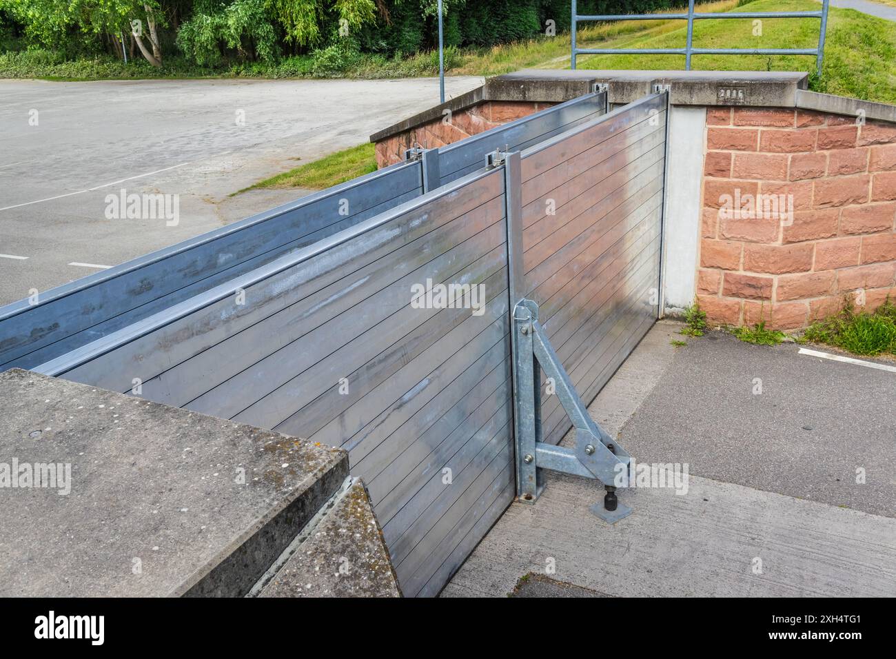 Modern flood barrier on a road, flood gates protecting city against ...
