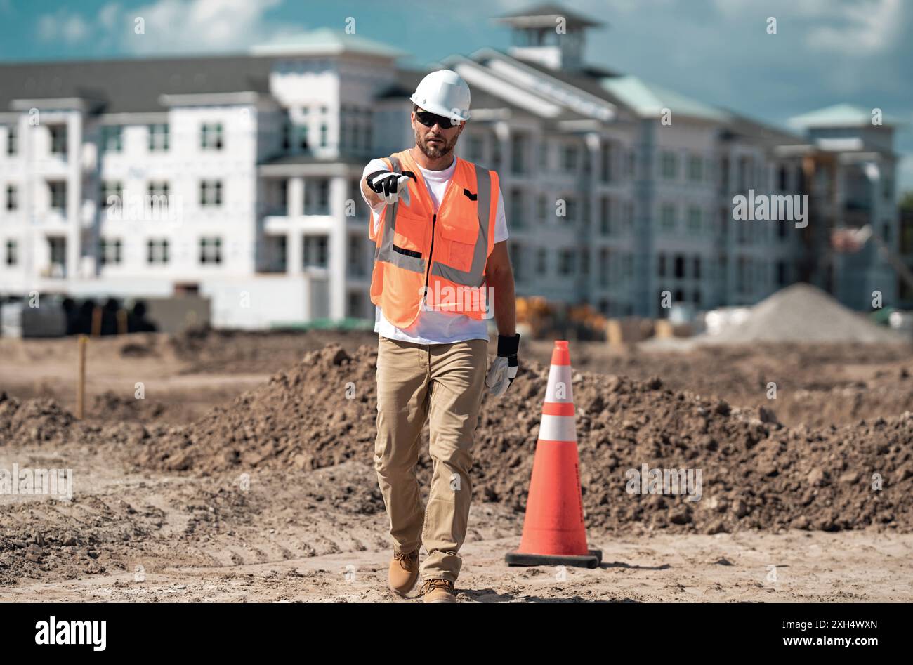 Construction builder in building uniform on buildings construction ...