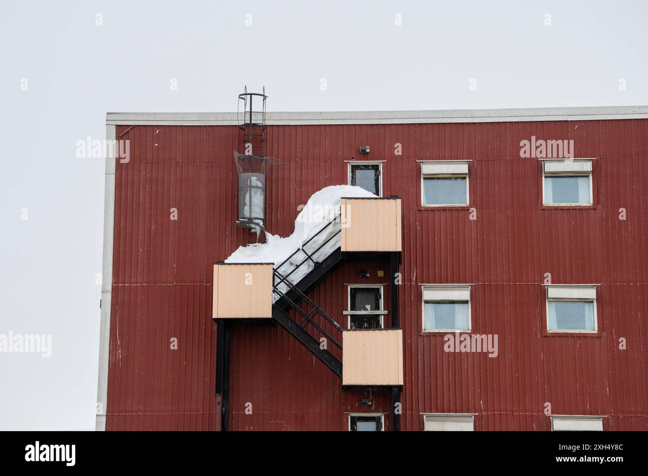 Large pile of snow accumulated on the fire escape stairs in Iqaluit ...
