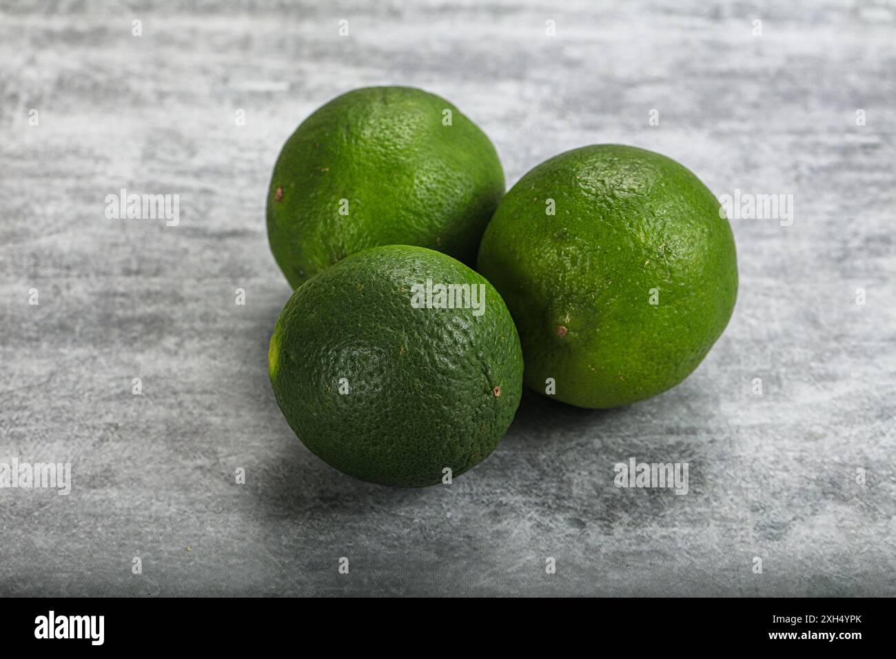 Green sour tropical Lime fruit heap Stock Photo - Alamy