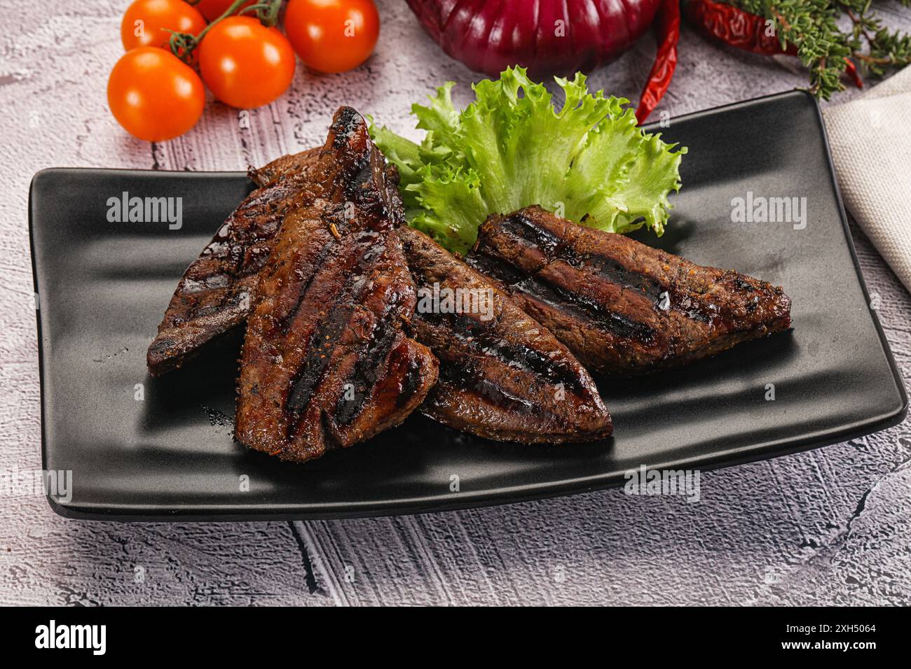 Grilled diet beef liver steak in the plate Stock Photo - Alamy