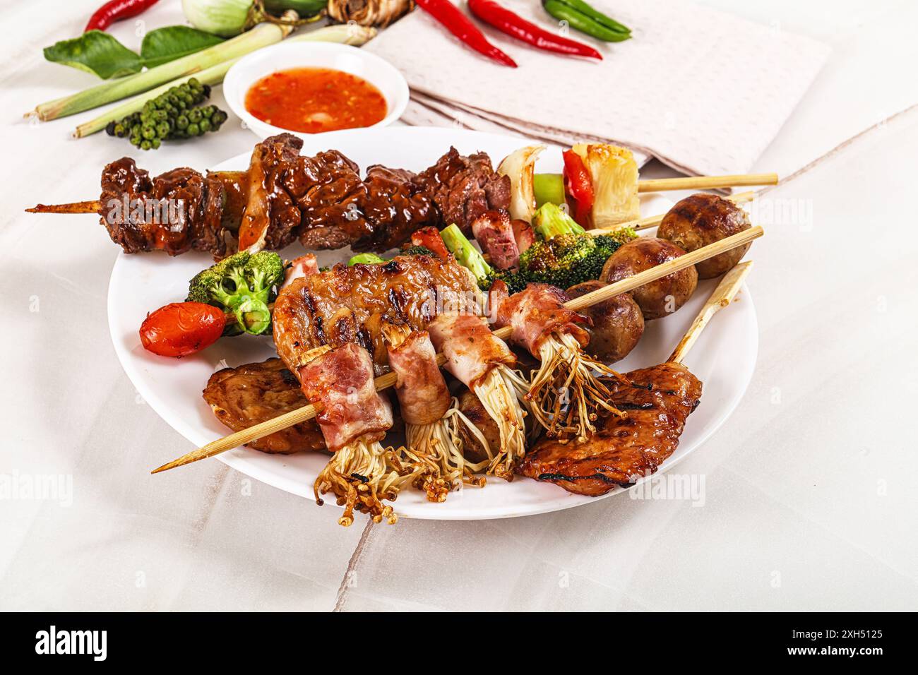 Asian grilled skewer assortment satay with beef, porl, chicken and ...