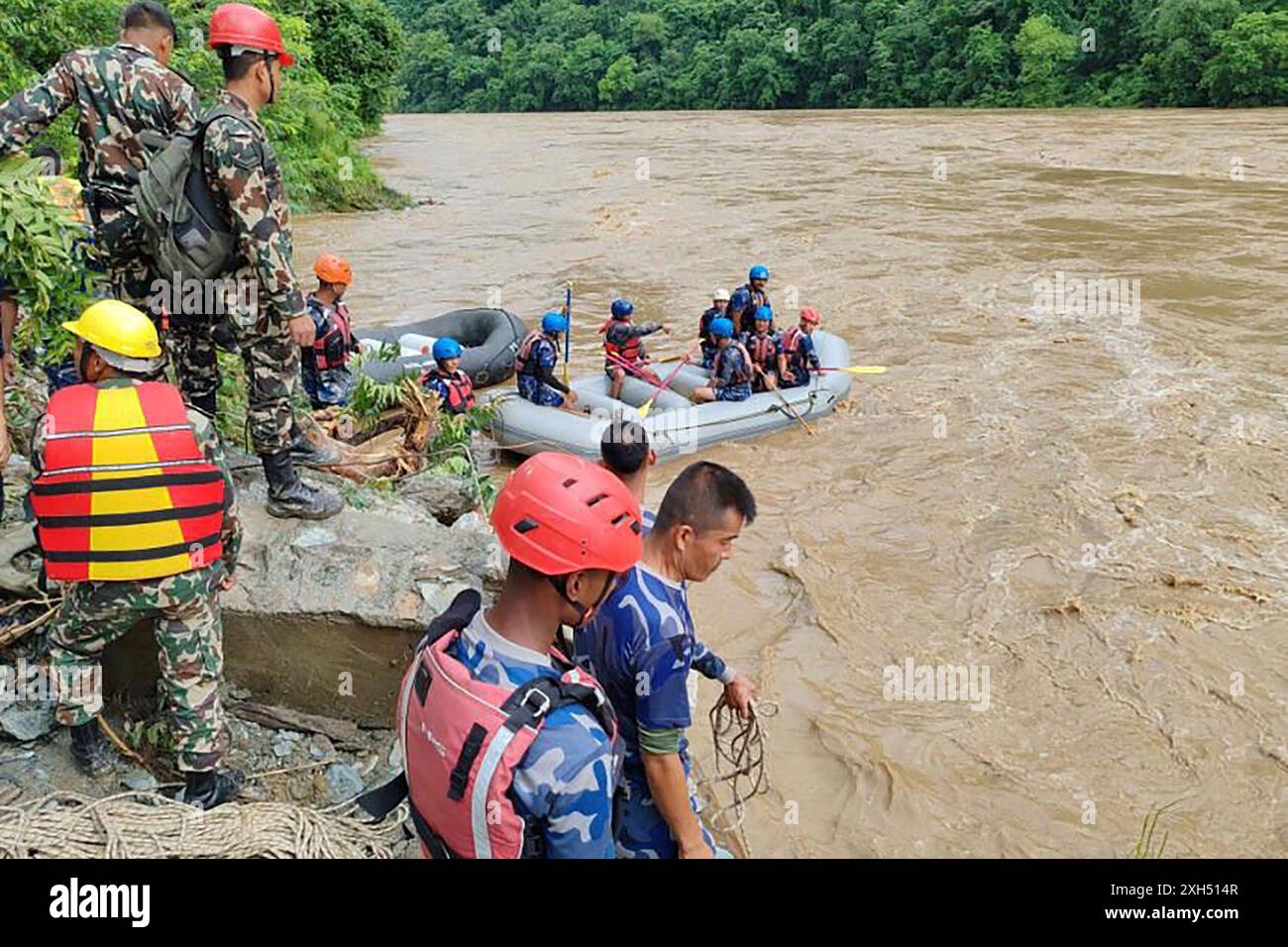 In this handout photograph released by Nepal Armed Police force, shows rescuers looking for the ...