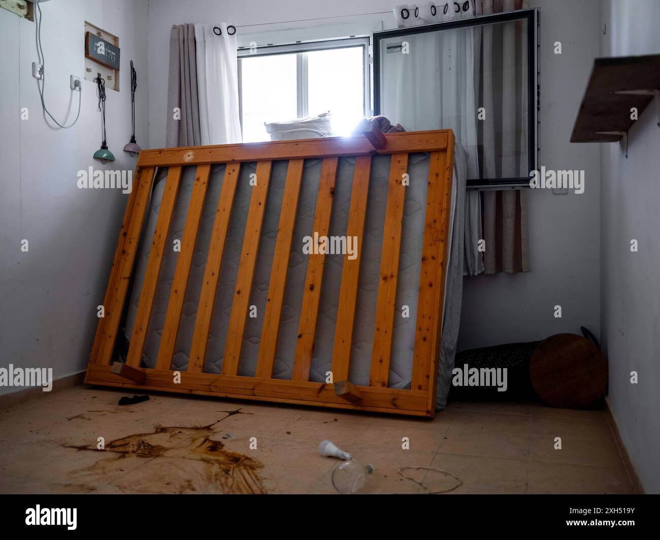 Blood stains the floor of the bedroom where Ariel Cunio, 27 and his ...