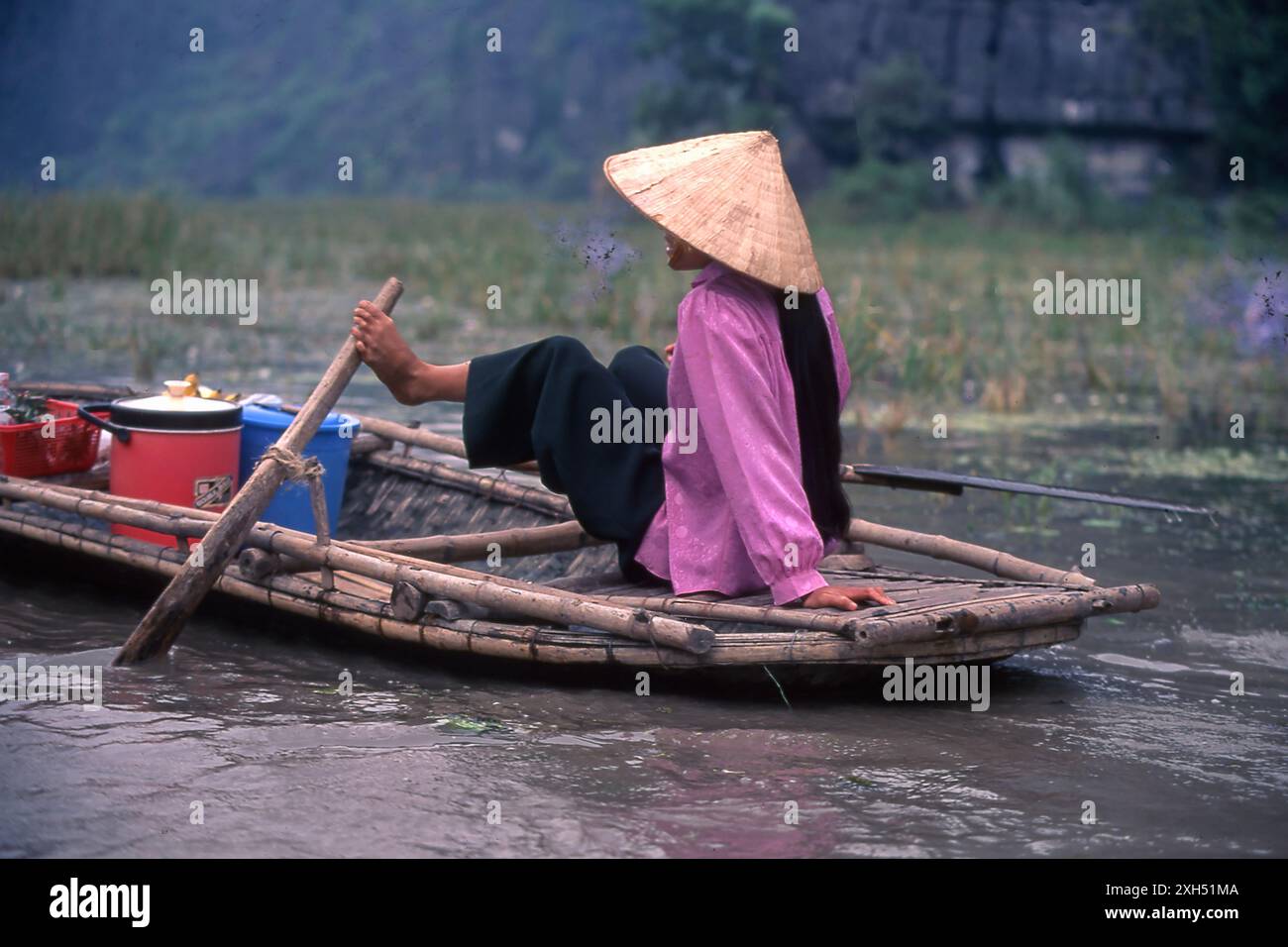 Woman rowing boat with feet, taken in 1998, Ninh Binh Province, Red ...