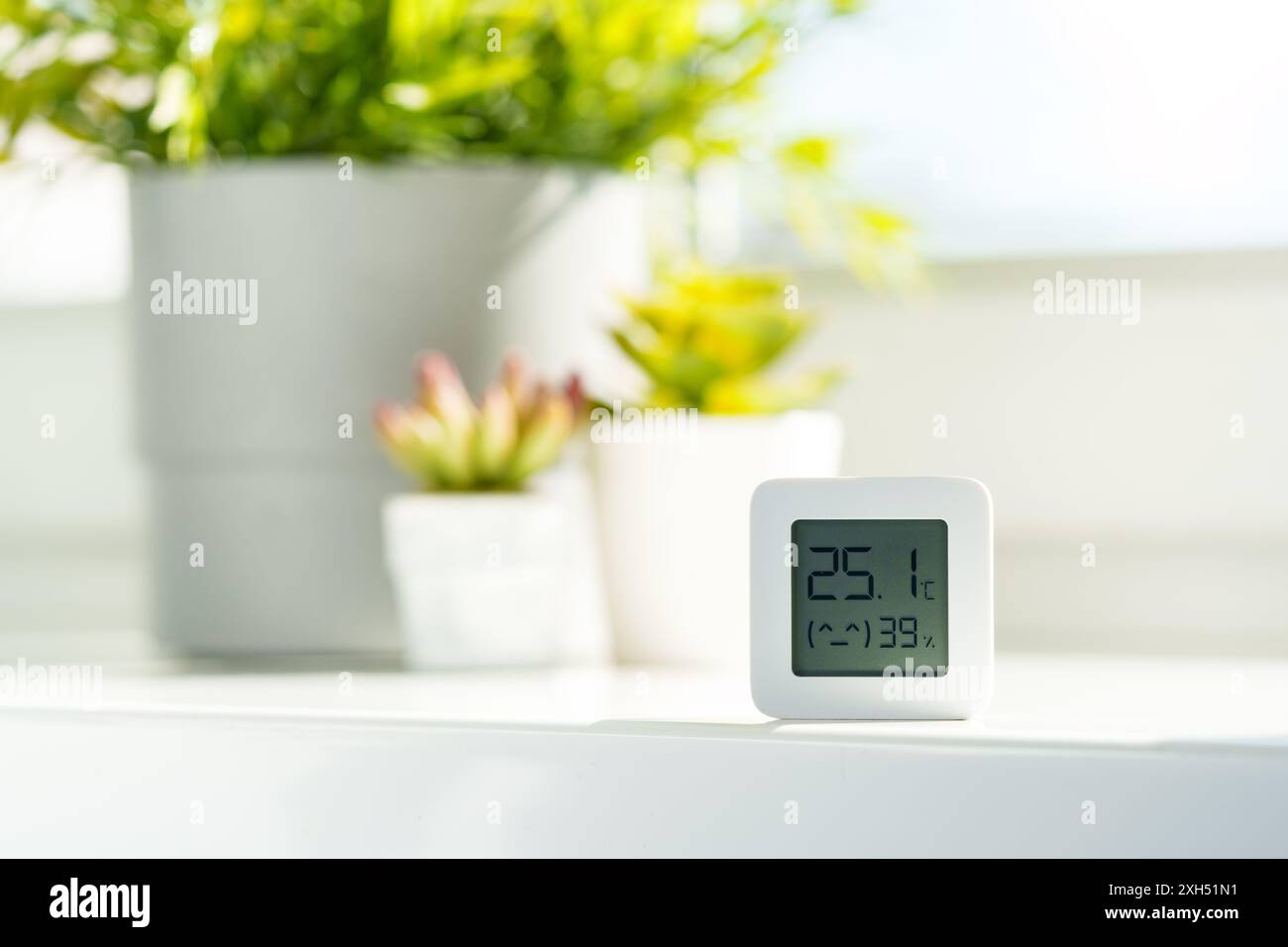 White Digital Thermometer Displaying Room Temperature and Humidity ...
