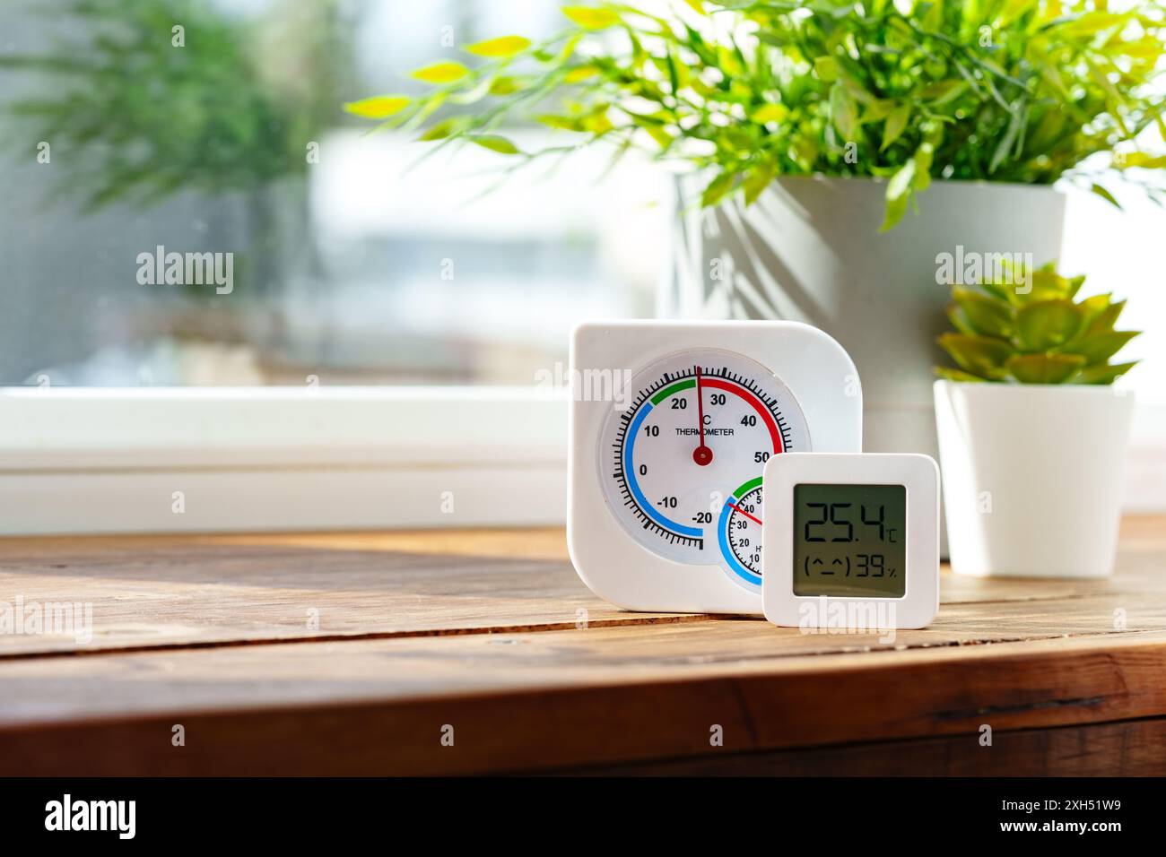 Digital Thermometer Displaying Temperature and Humidity Near Window ...