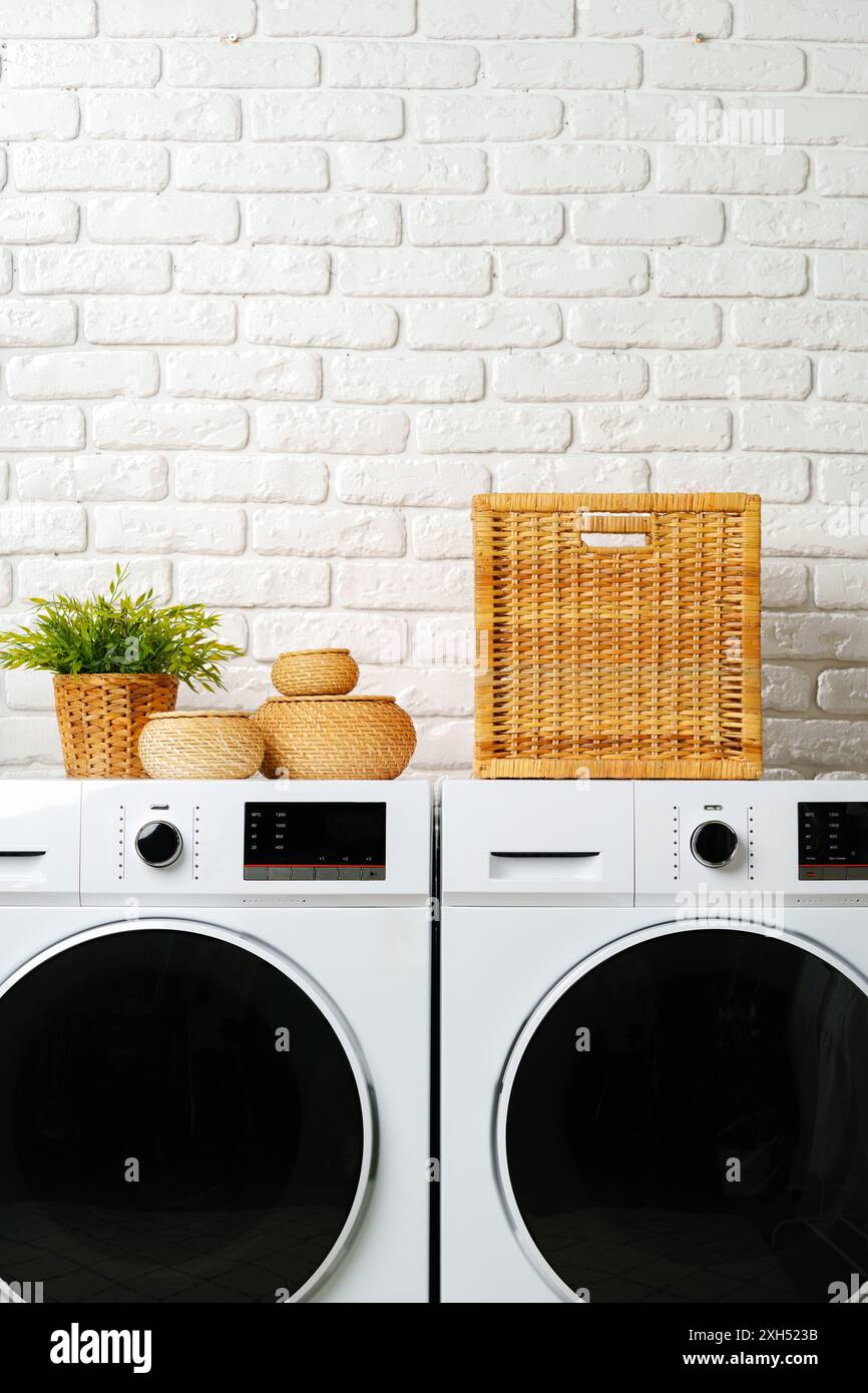 White Laundry Appliances in a Modern Bathroom With White Brick Wall ...