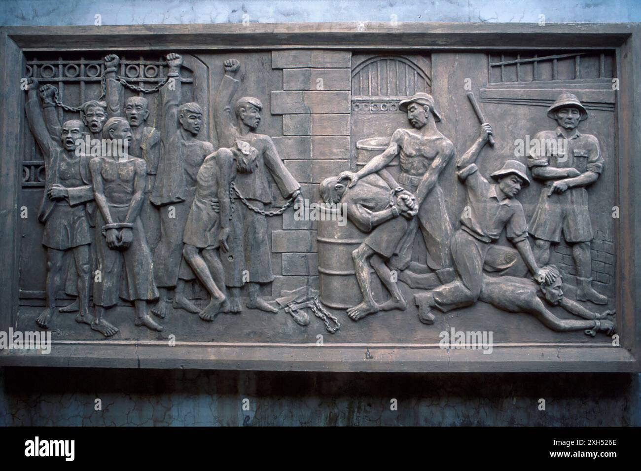 Bas relief of defiant Vietnamese prisoners being tortured by French ...